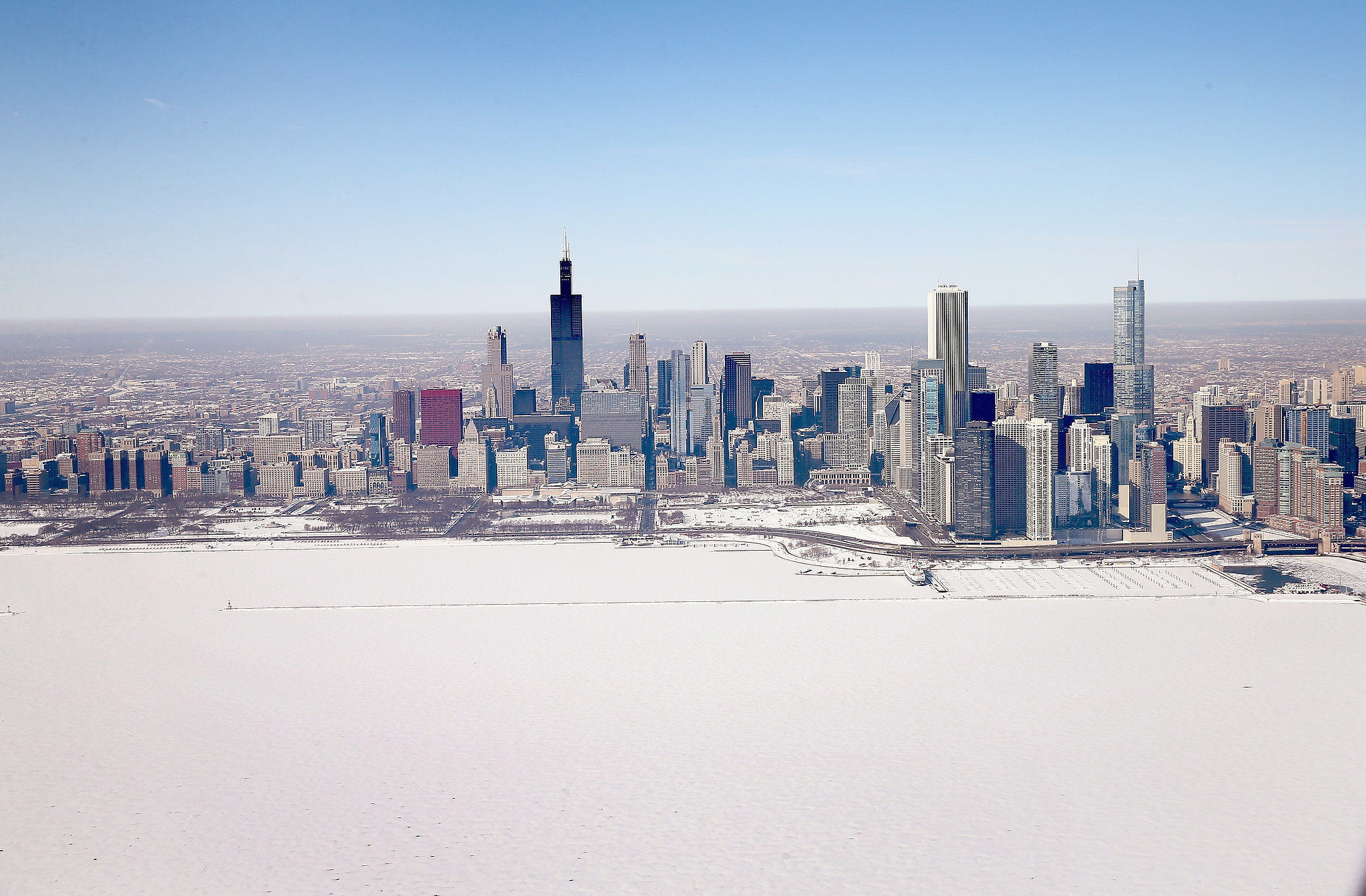 Chicago's shoreline is covered in snow following a crazy-cold Winter ...